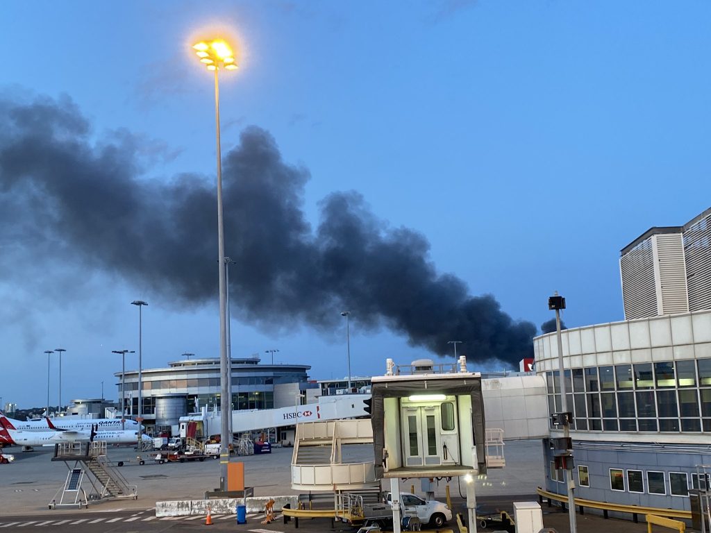 BREAKING A large fire has broken out near the Qantas terminal at Sydney ...